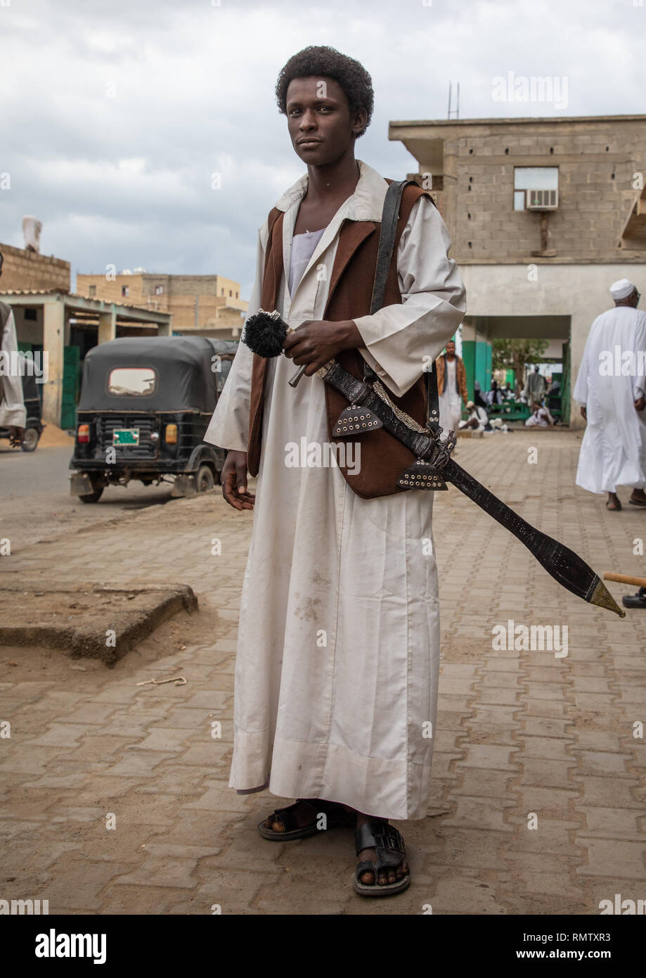 Beja tribe warrior with his sword in the street, Red Sea State, Port ...