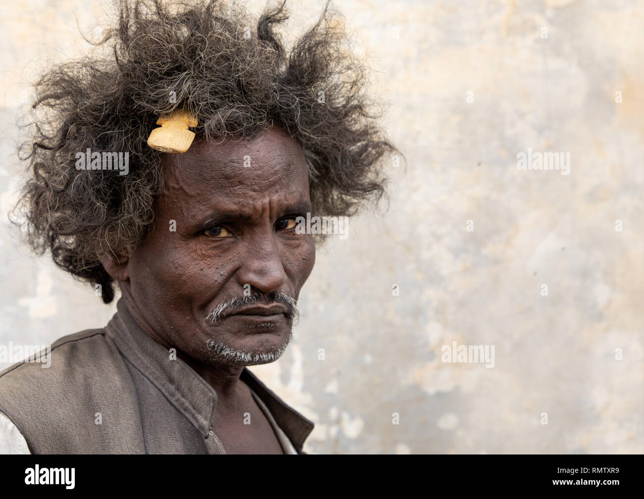 Portrait of a Beja tribe man with a wooden comb in the hair, Red Sea ...