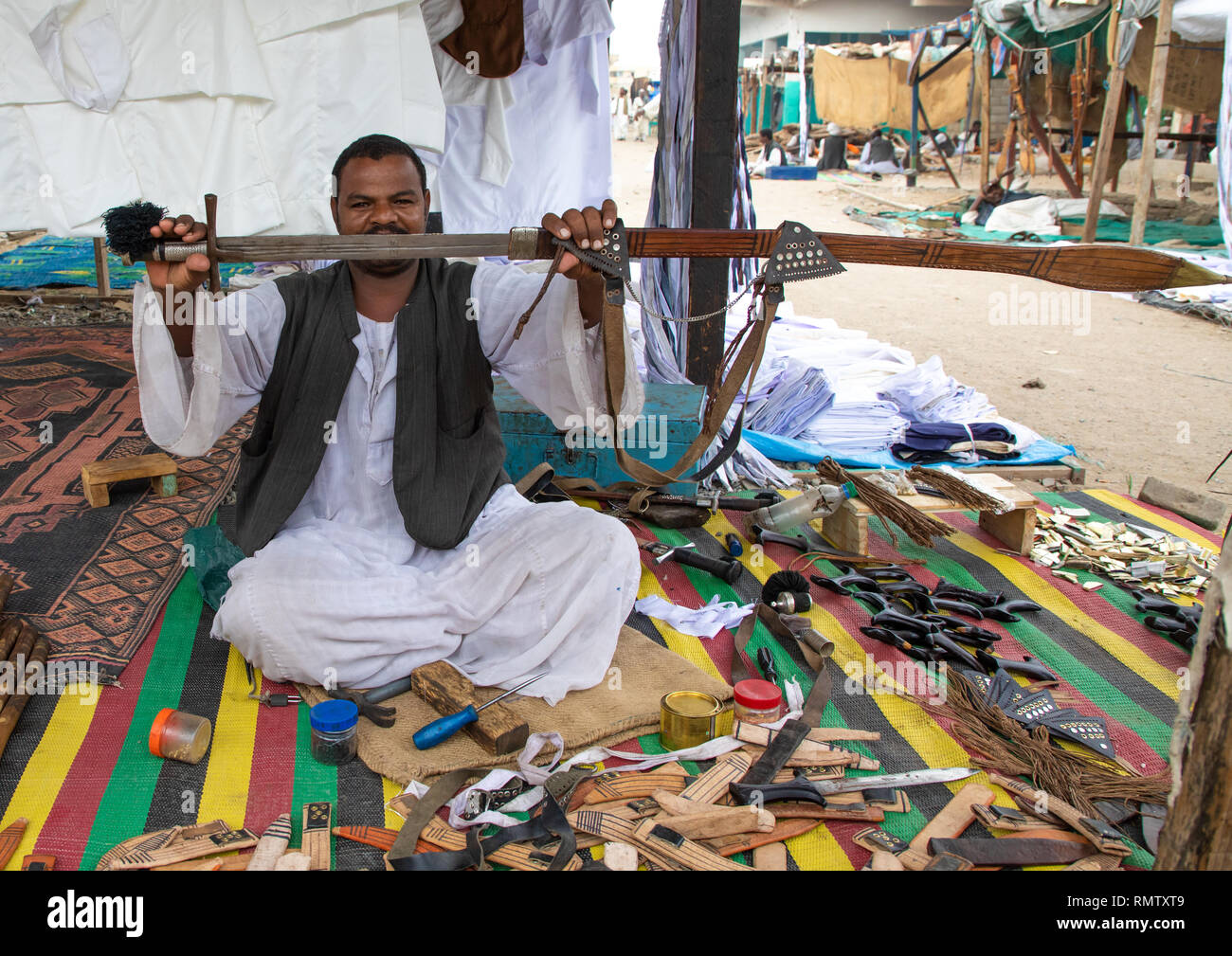 Portrait of a Beja tribe man selling sword in the market, Red Sea State ...