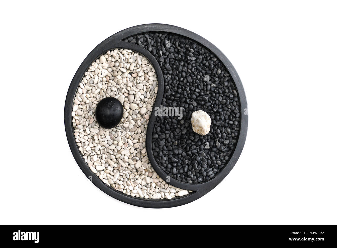 Yin and Yang Symbol made of white and black stones, top view, isolated ...