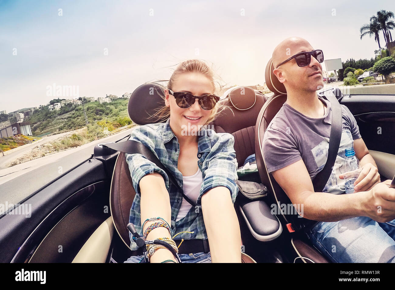 Two male friends driving open hi-res stock photography and images - Alamy