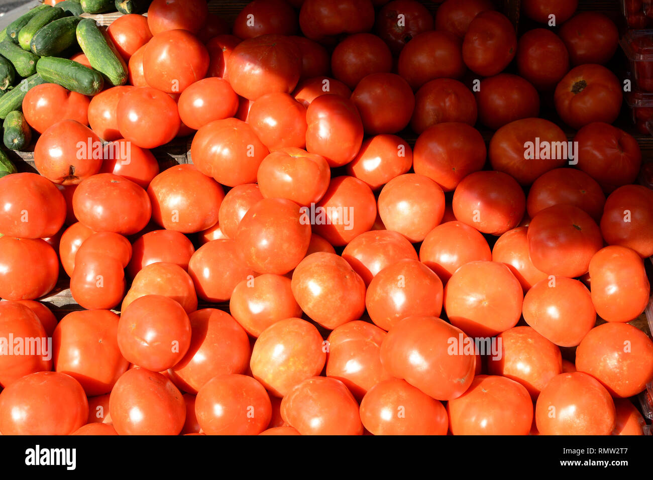 Tomatoes Stacked In Display On a Fruit Stand at a Corner Store Stock ...