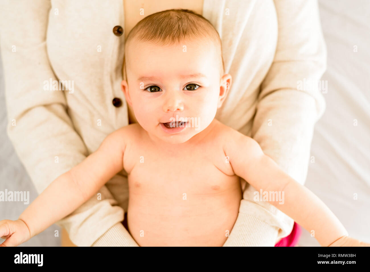 Nice newborn baby laughing Stock Photo - Alamy