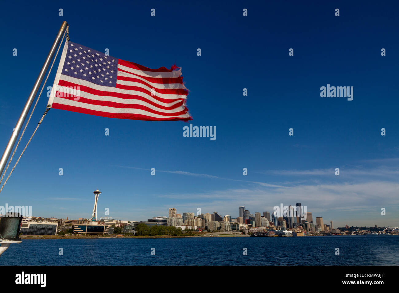A view of the Seattle skyline, USA. With the flag of the USA Stock ...