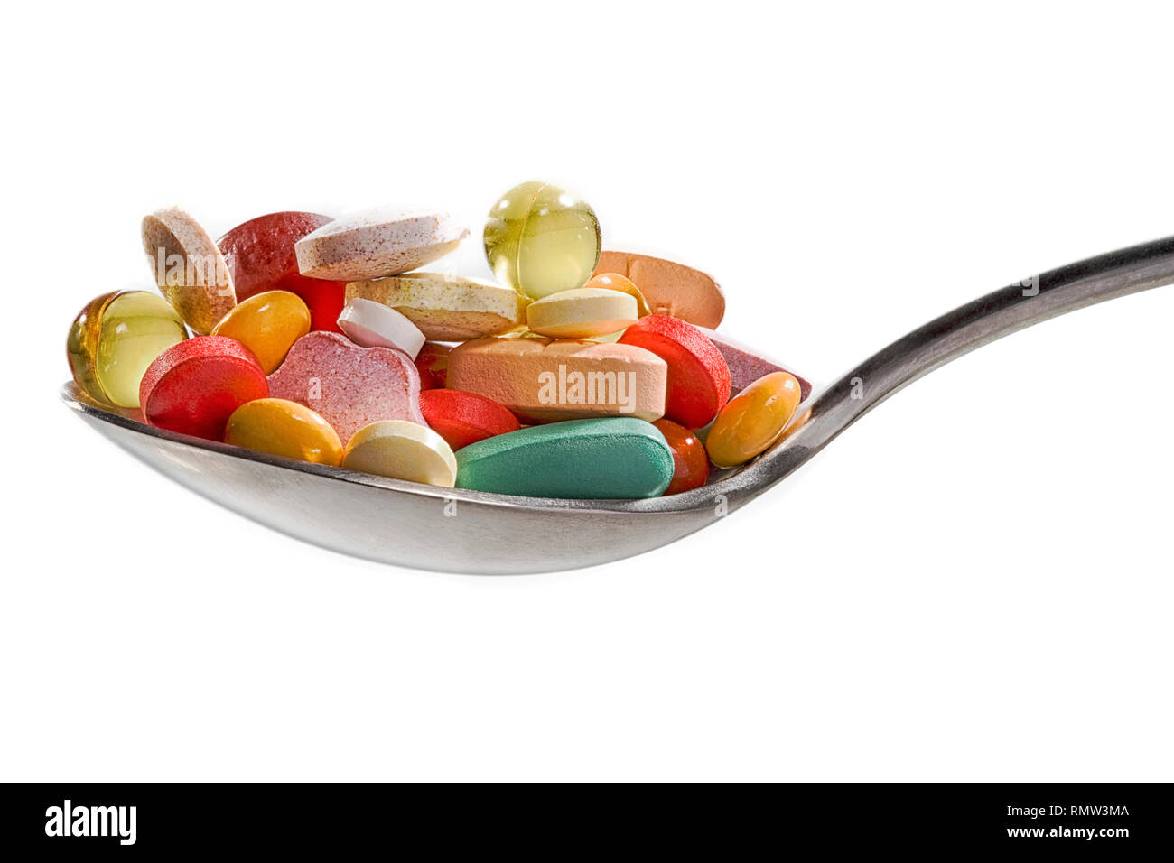Capsules with food supplements in spoon hi-res stock photography and ...