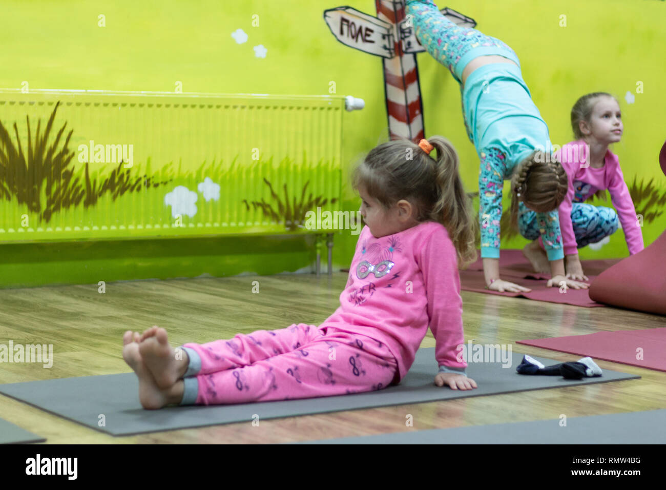 Children do yoga in pajamas with a professional teacher Stock Photo - Alamy
