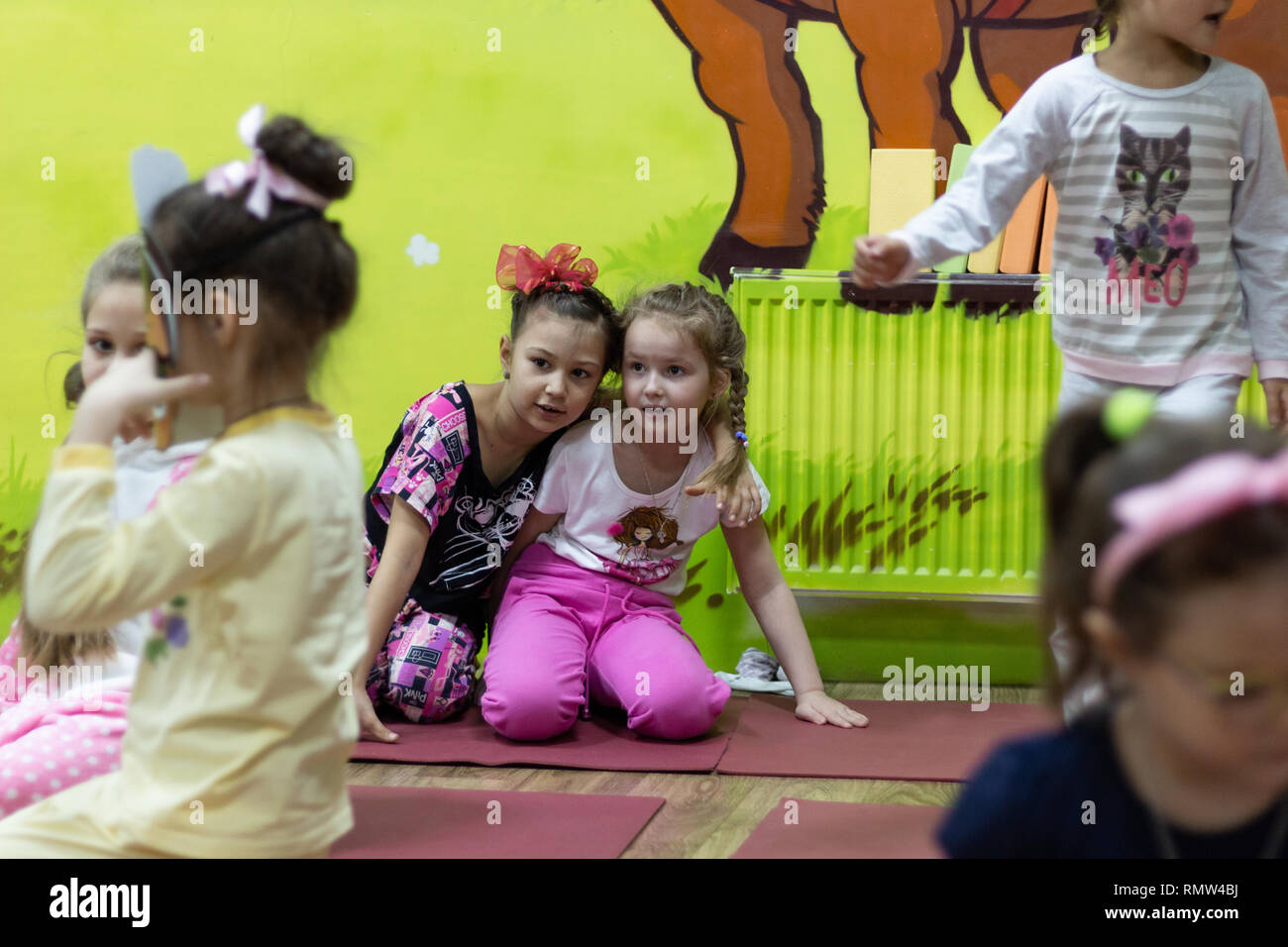 Children do yoga in pajamas with a professional teacher Stock Photo - Alamy