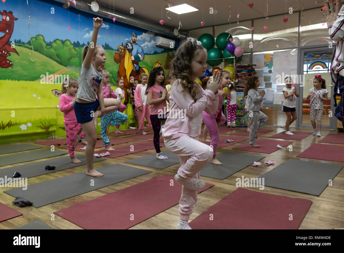 Children do yoga in pajamas with a professional teacher Stock Photo - Alamy