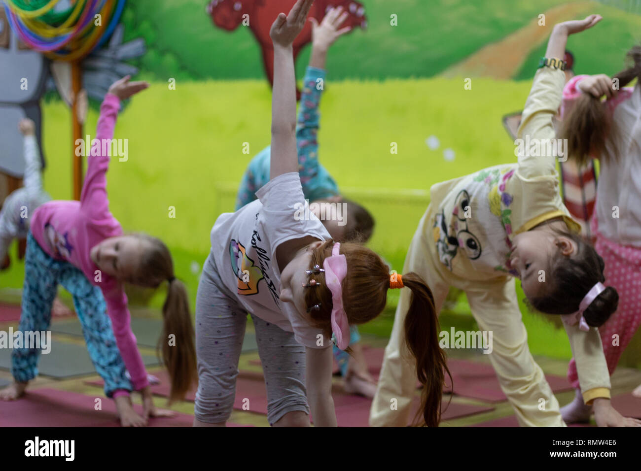 Children do yoga in pajamas with a professional teacher Stock Photo - Alamy