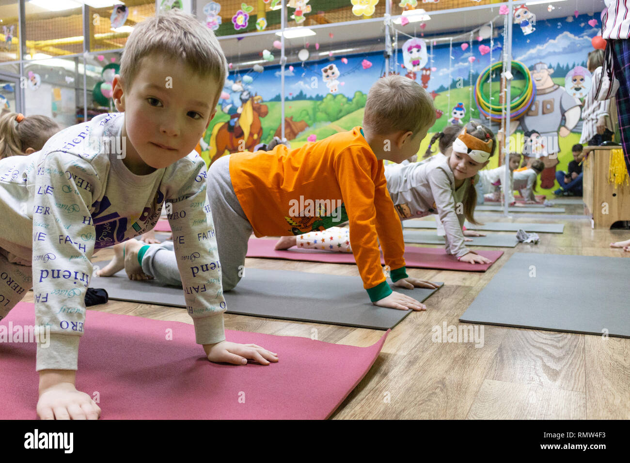 Children do yoga in pajamas with a professional teacher Stock Photo - Alamy