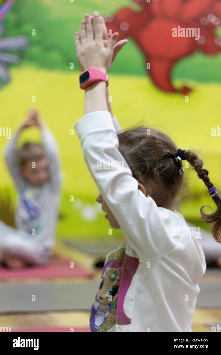 Children do yoga in pajamas with a professional teacher Stock Photo - Alamy