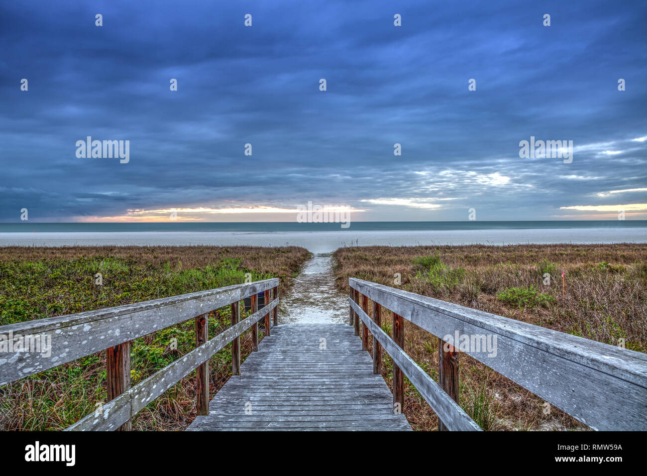 White sand path leading through the beach grass at Tigertail Beach at ...