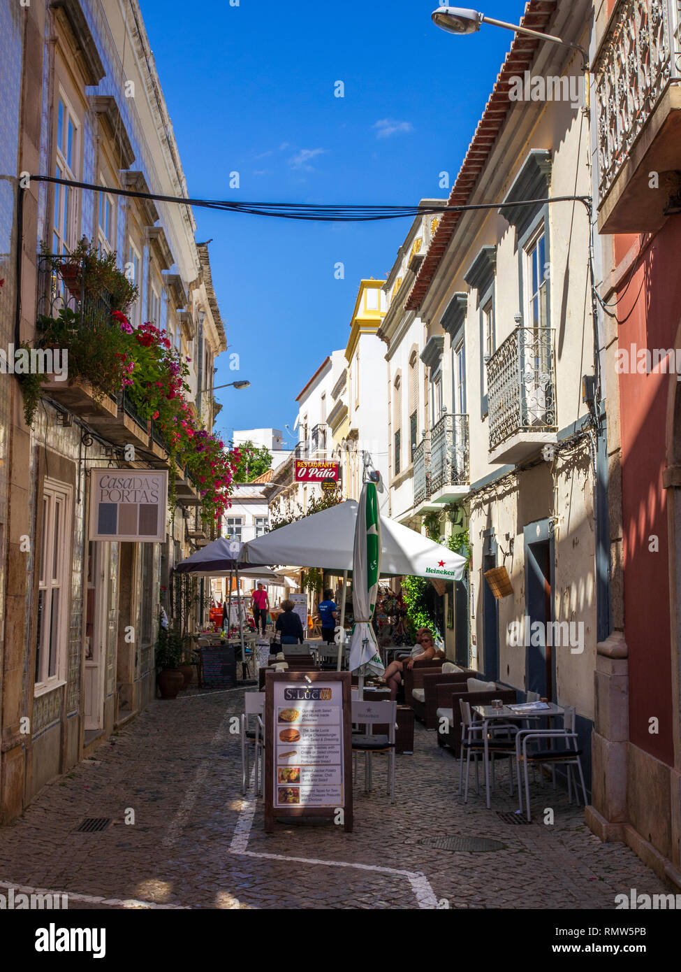 Restaurants on a back street in Tavira, a Moorish- built town on the ...