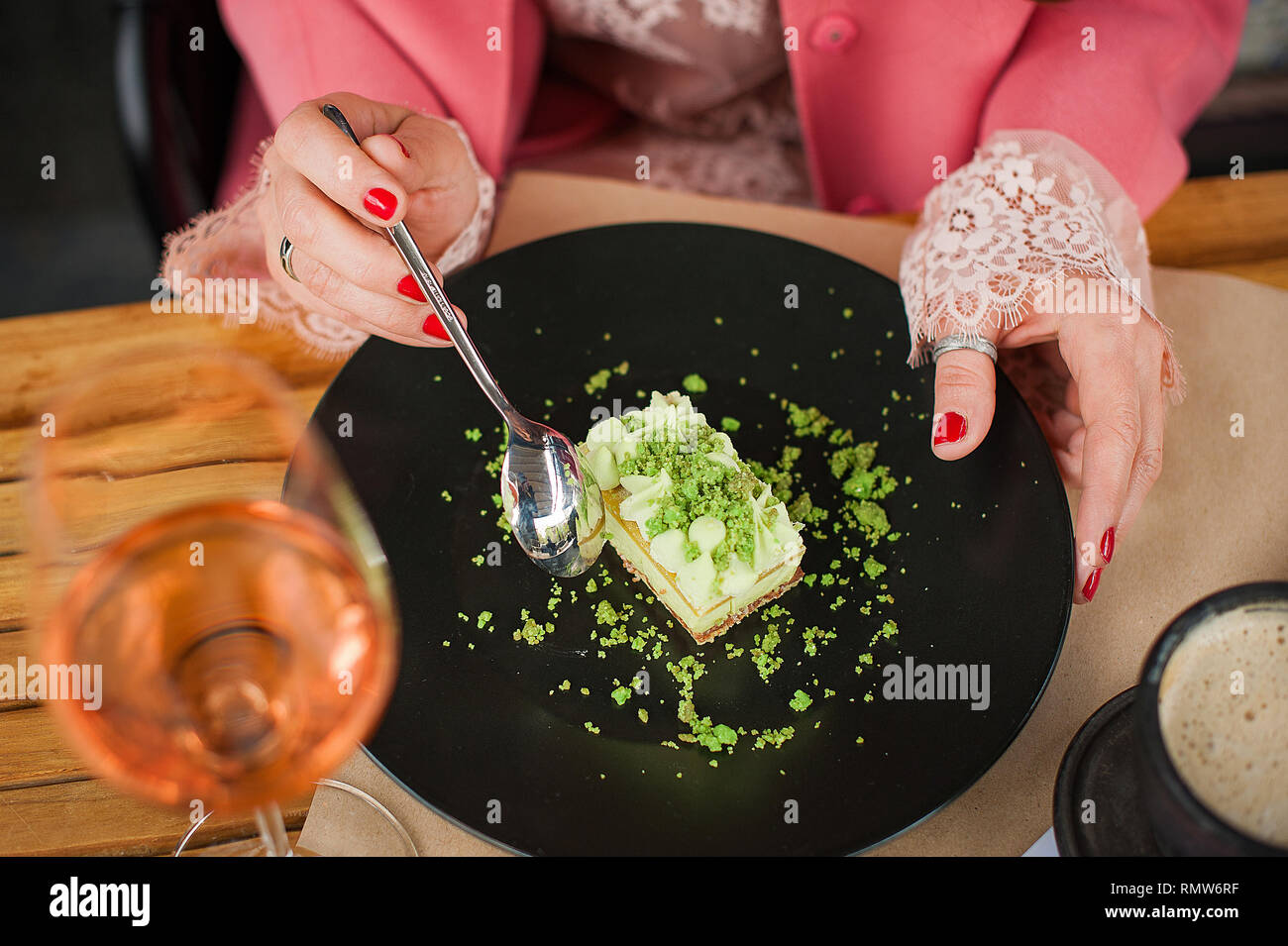 Woman eating cake black hi-res stock photography and images - Alamy