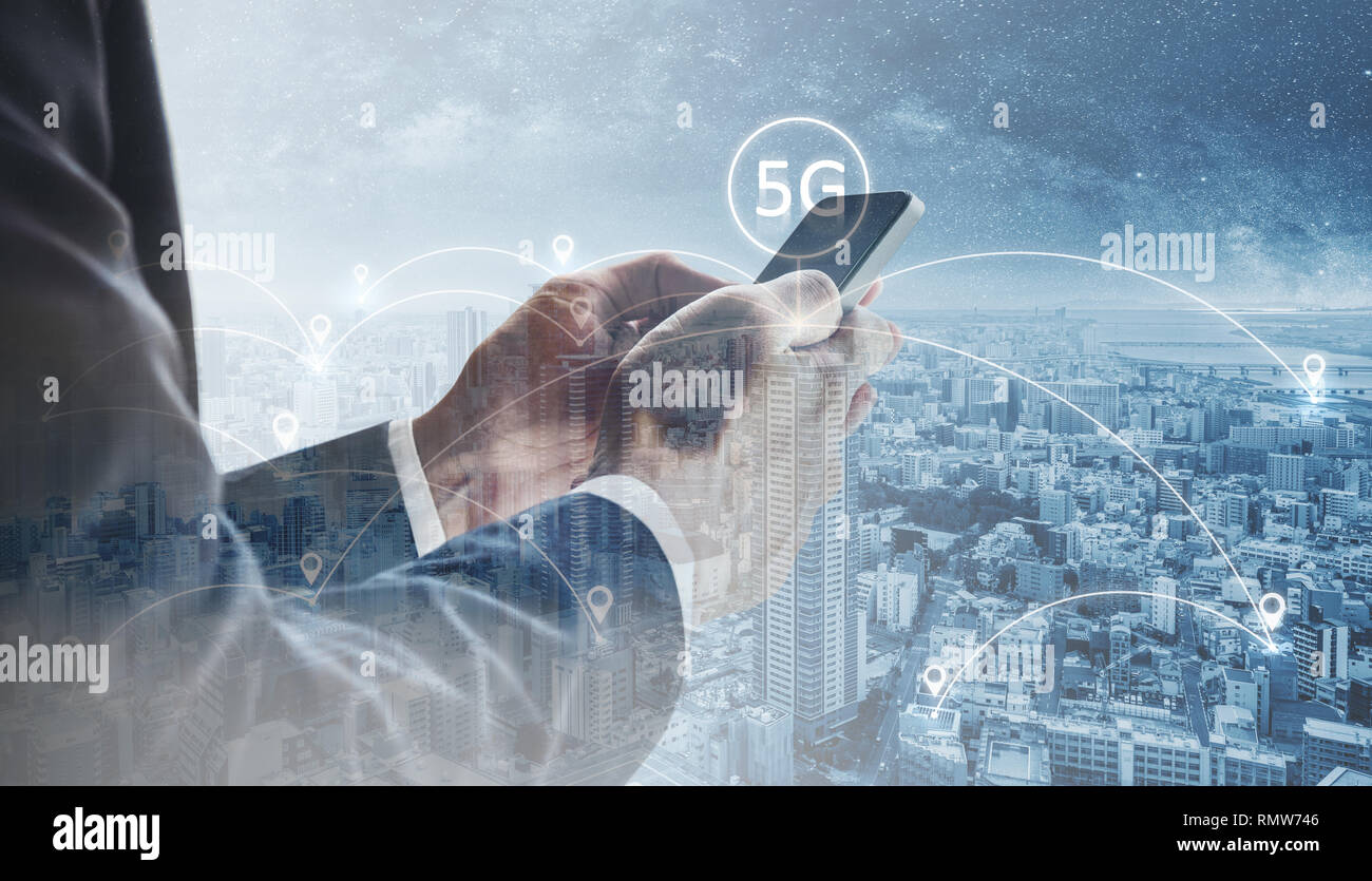 Double exposure, Businessman using mobile smart phone with cityscape ...
