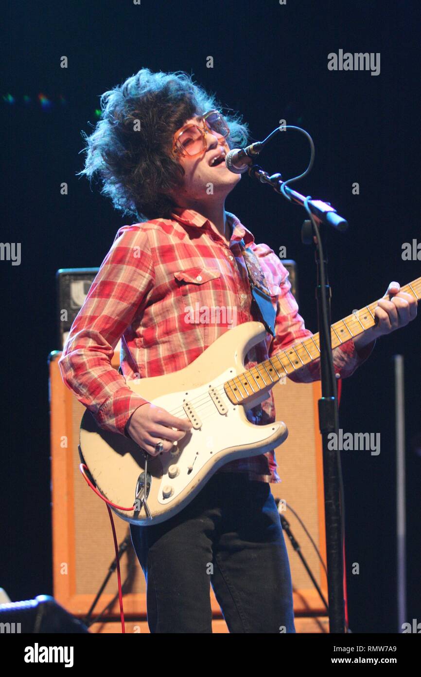 The guitarist and vocalist of Paper Zoo is shown performing on stage ...