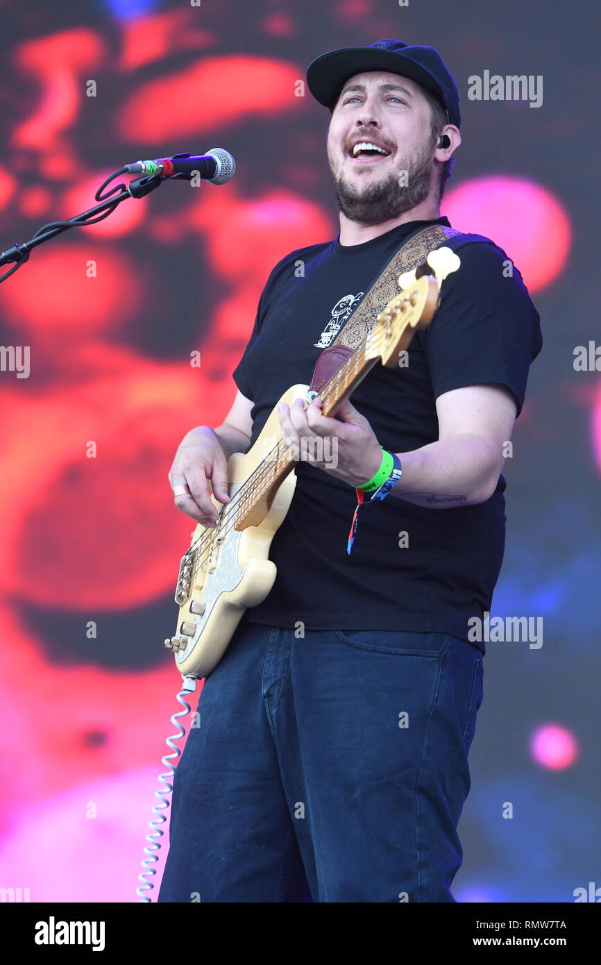 Bassist Zachary Carothers is shown performing on stage during a "live ...