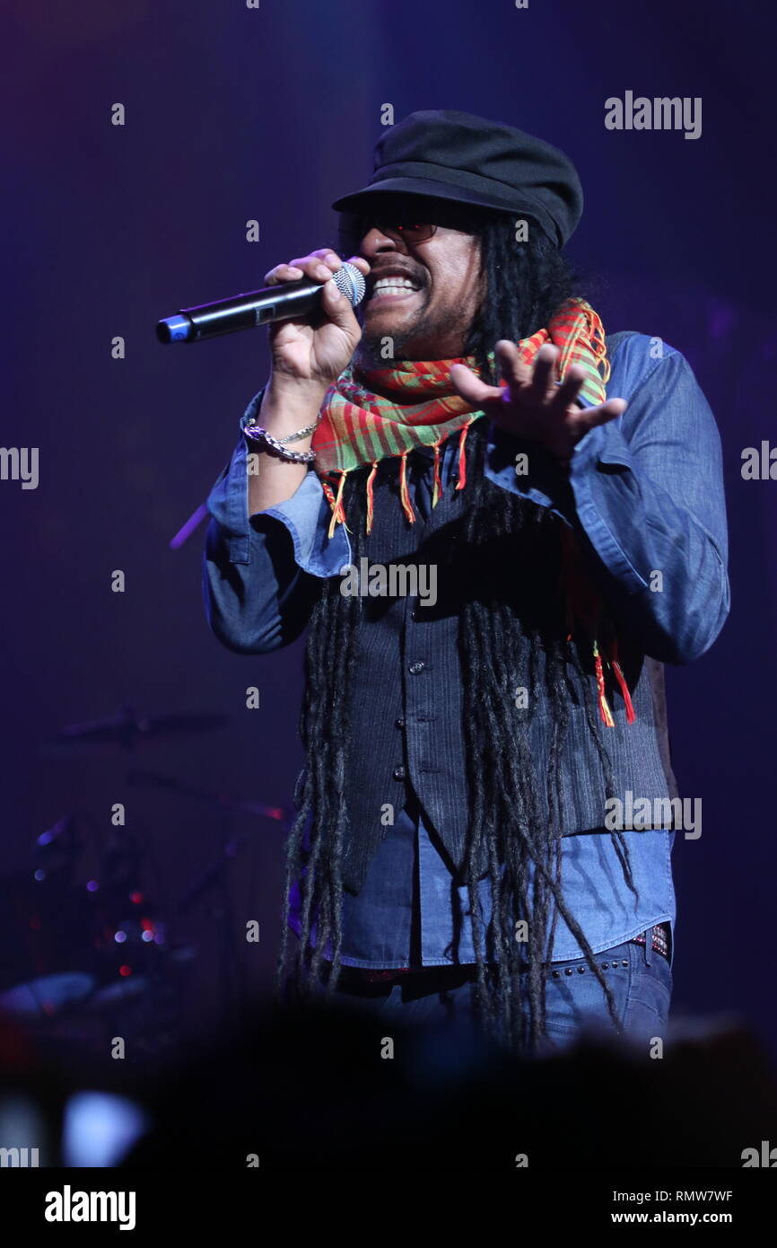Singer Maxi Priest is shown performing on stage during a "live" concert ...