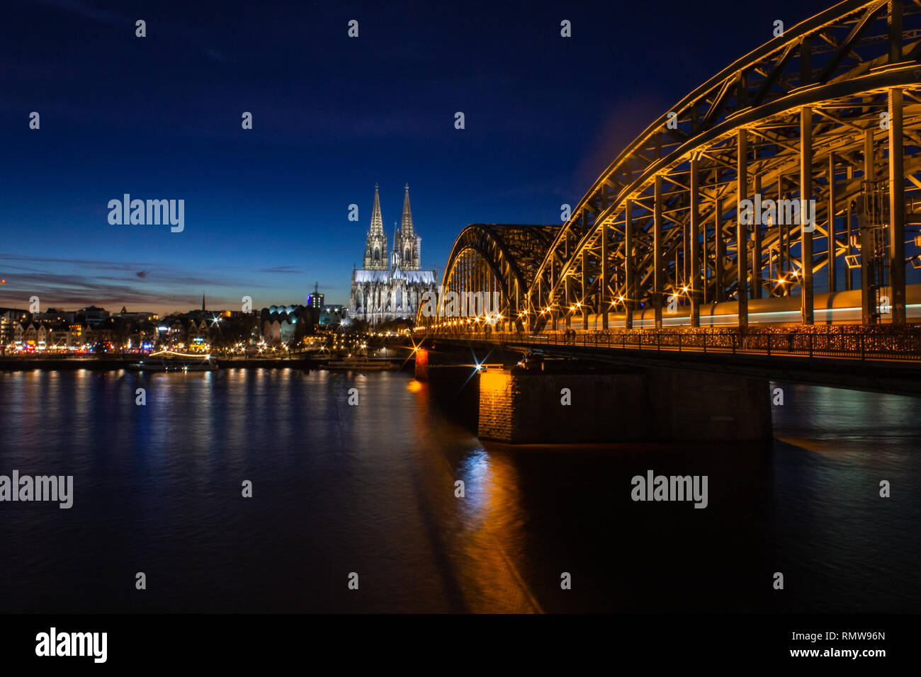 Cologne skyline with Cologne Cathedral and Hohenzollern bridge at night ...