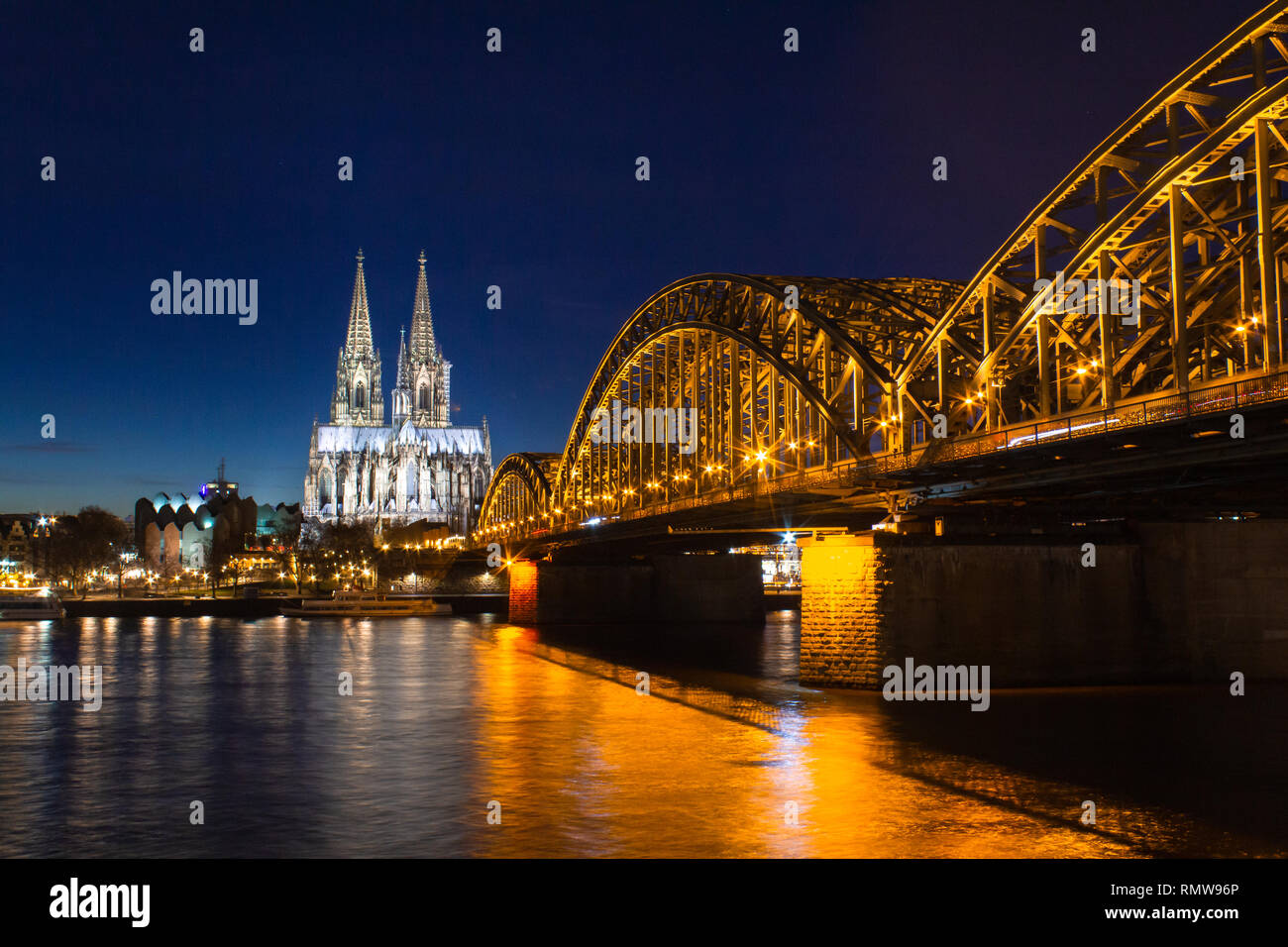 Cologne skyline with Cologne Cathedral and Hohenzollern bridge at night ...