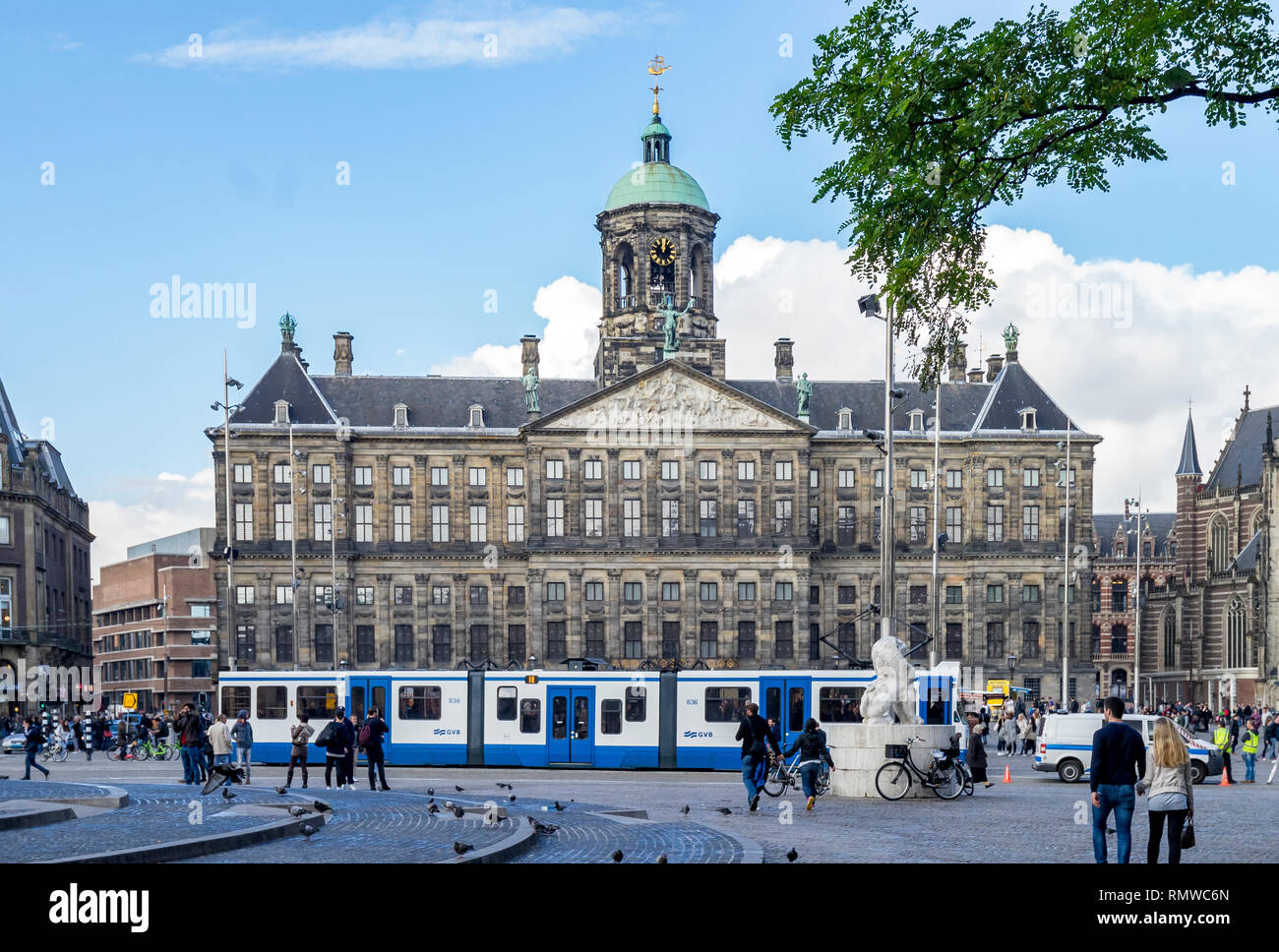 Tourists at the historical central square in Amsterdam in front of the ...