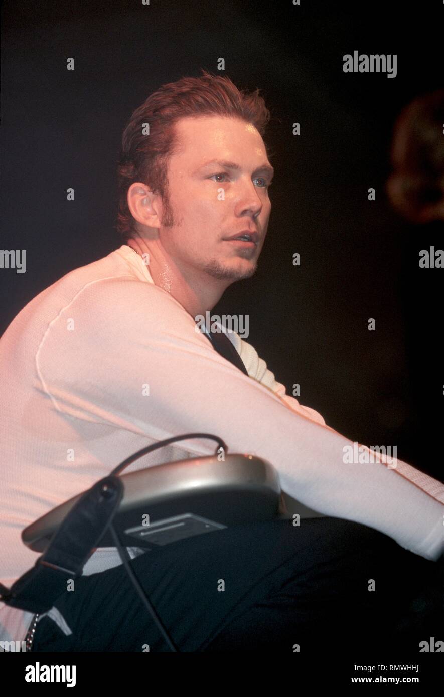 The lead singer and guitarist of the rock band Oleander is shown ...