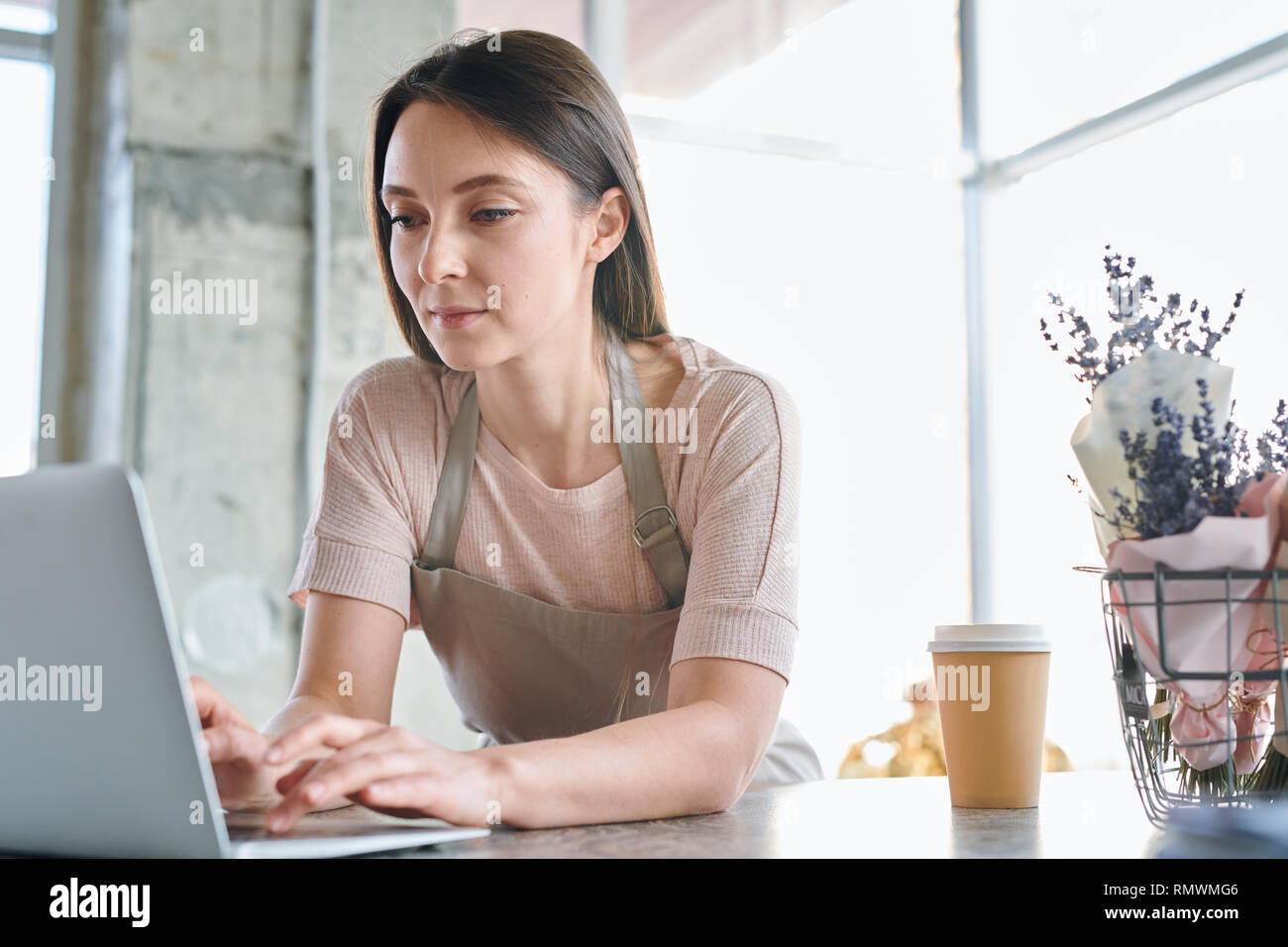 Woman bending over table hi-res stock photography and images - Alamy