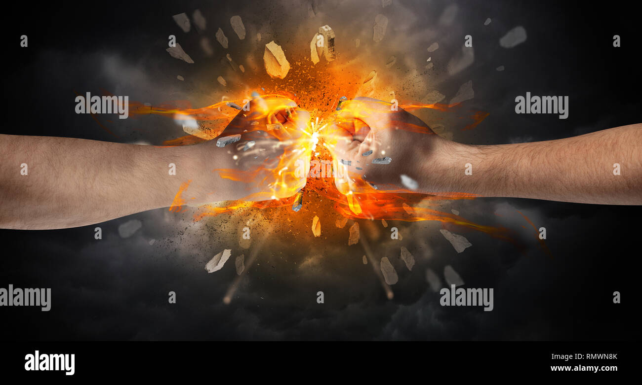 Two hands fighting and breaking a rock into small pieces Stock Photo ...