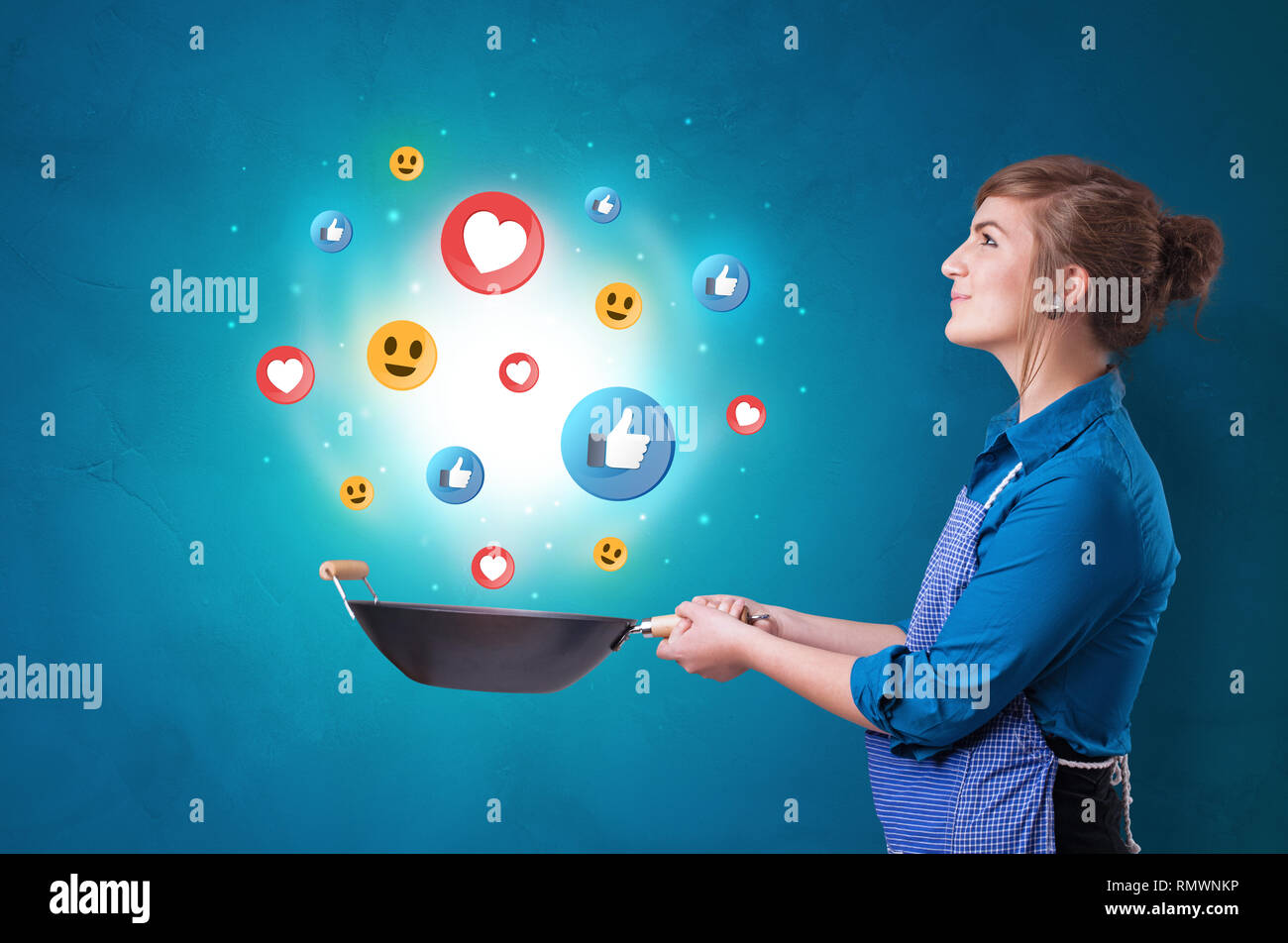 Young happy person cooking social media concept in wok Stock Photo - Alamy