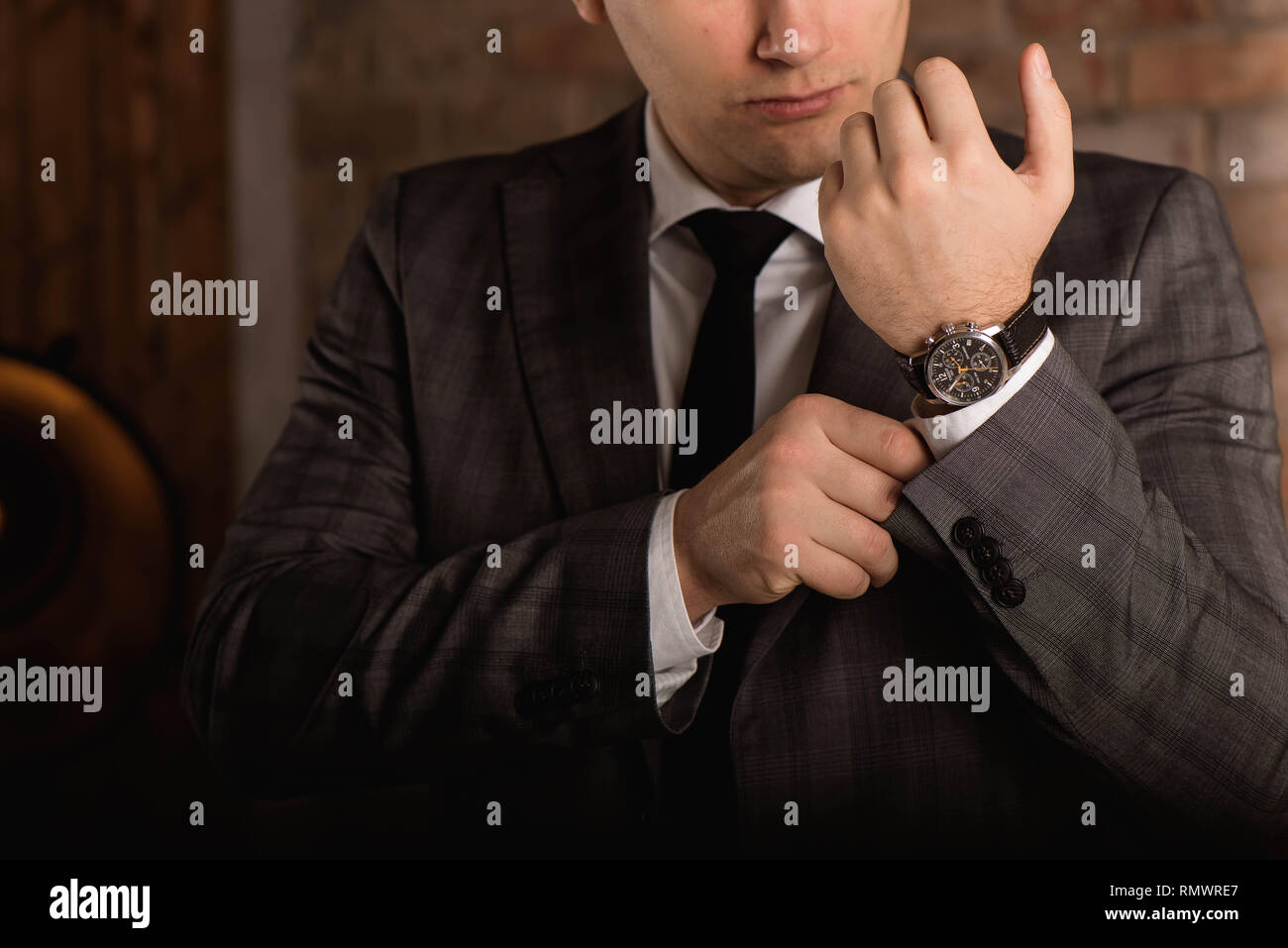 Man correcting sleeve hi-res stock photography and images - Alamy