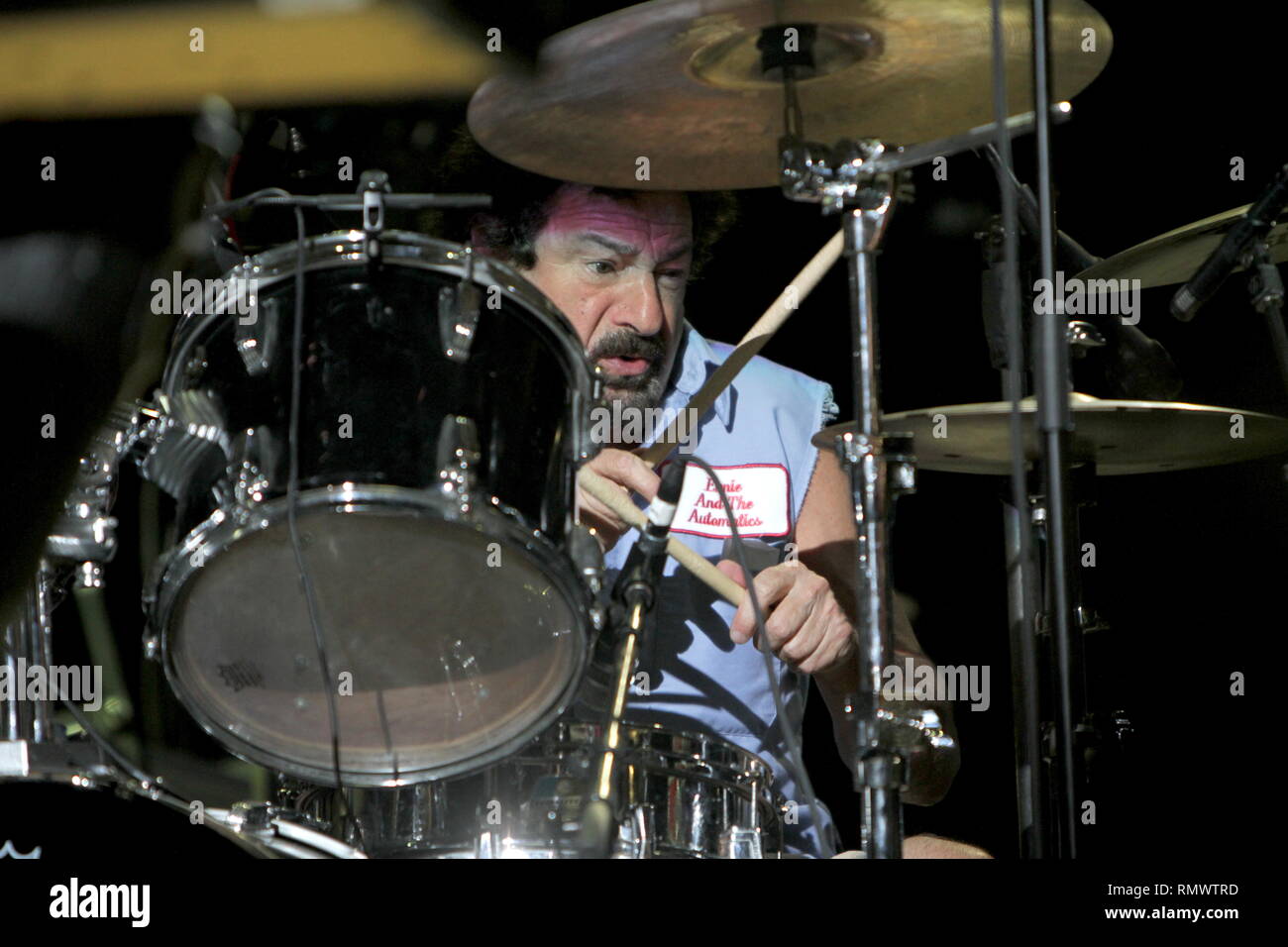 Ernie & the Automatics band member is shown performing on stage during ...