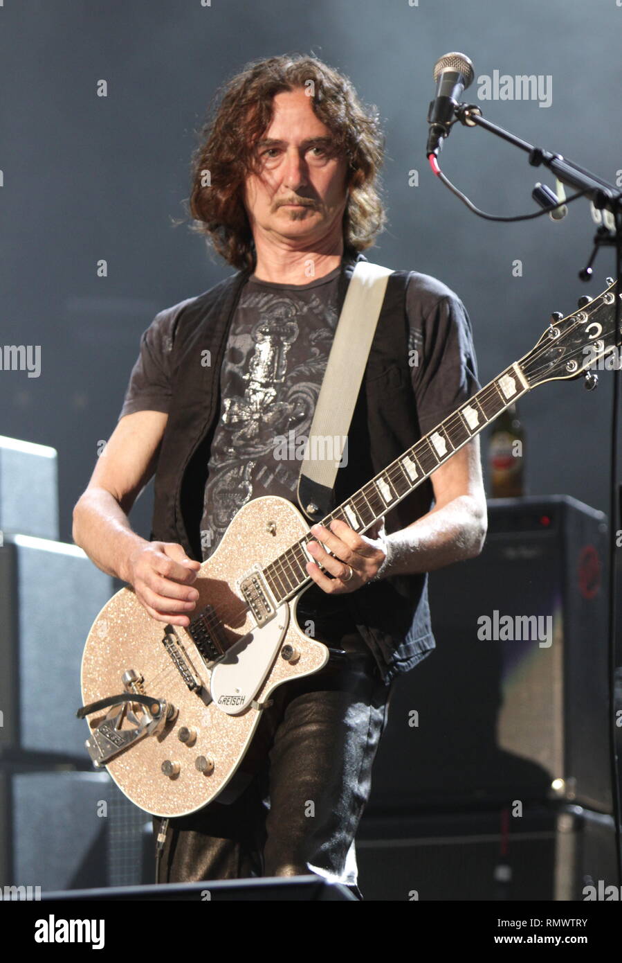 Ernie & the Automatics band member is shown performing on stage during ...