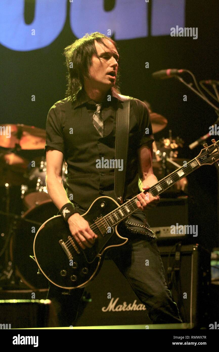 Guitarist Dave French is shown performing on stage during a "live ...