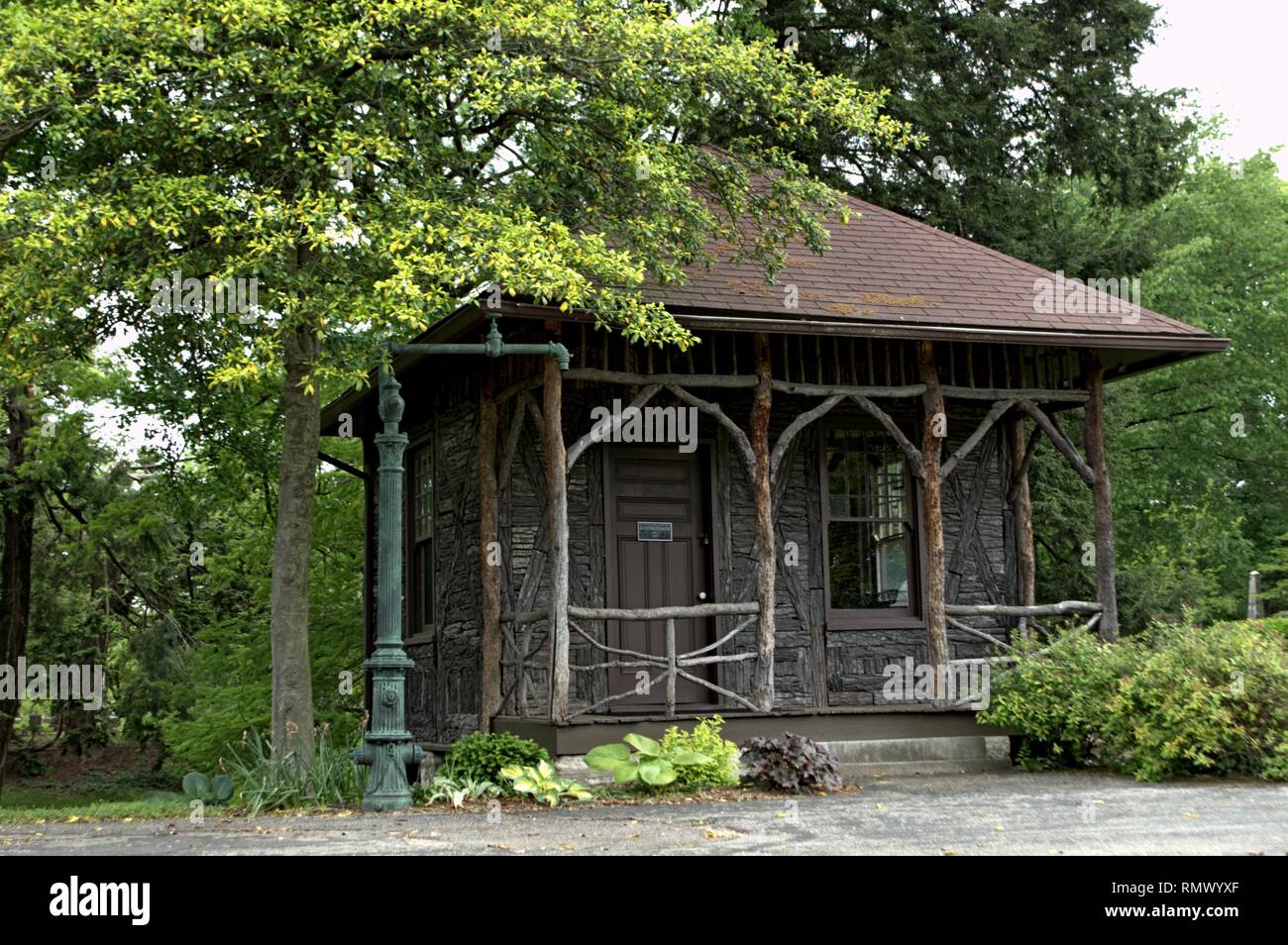 A rustic shelter house in a cemetery Stock Photo - Alamy