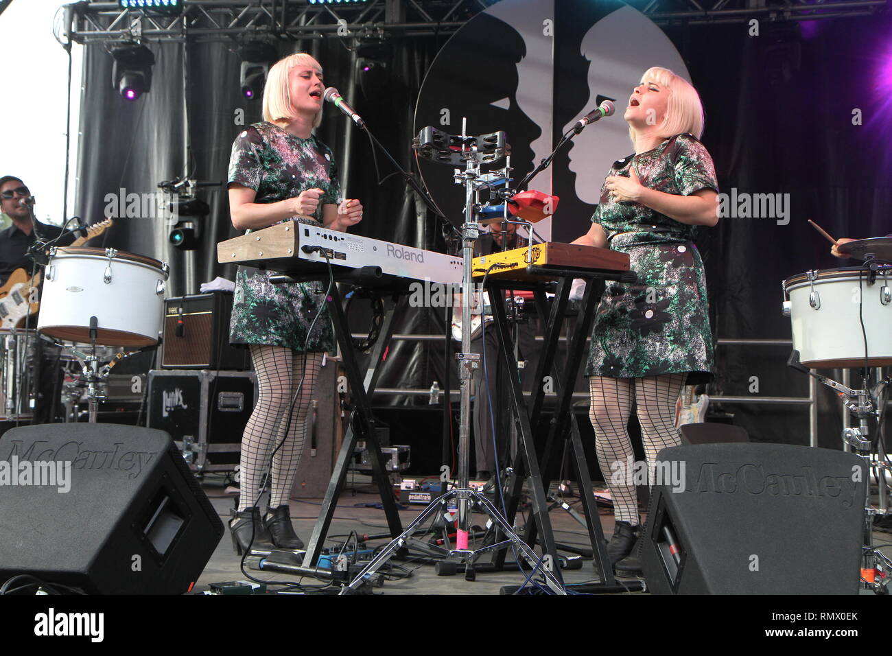 Musicians Jess Wolfe and Holly Laessig are shown performing on stage ...