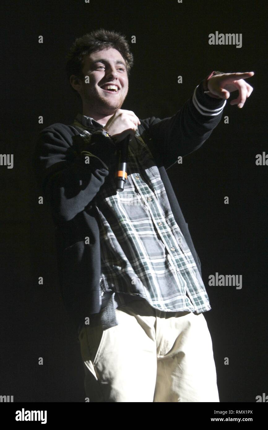 Rapper Mac Miller is shown performing on stage during a "live" concert ...