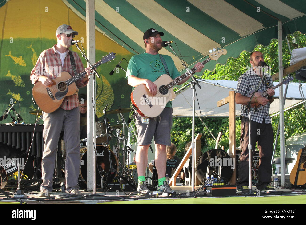 Moe is shown performing on stage during as "live" acoustic concert ...