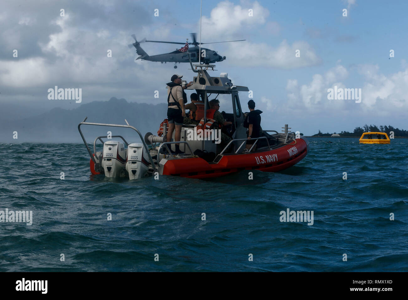 U.S. Sailors with Water Front Operations standby as U.S. Marines with ...
