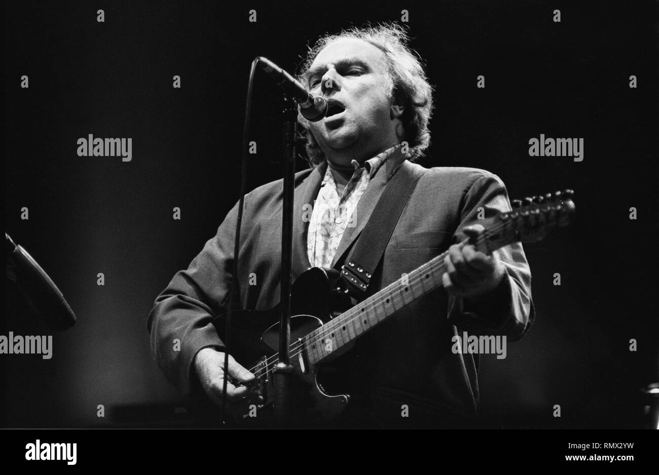 Musician Van Morrison is shown performing on stage during a "live ...