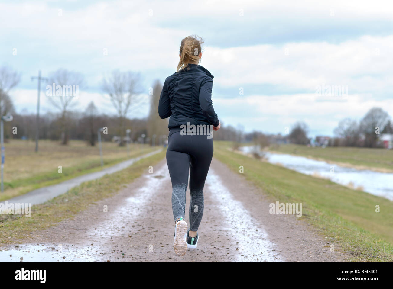 Athlete running away from camera hi-res stock photography and images ...