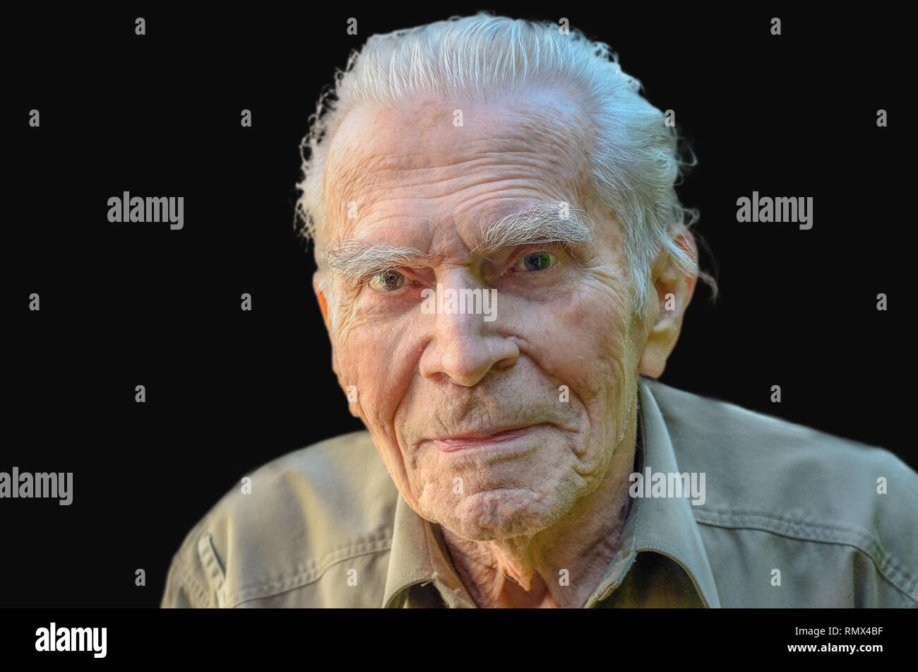Close up head and shoulders of a distinguished elderly man looking at ...