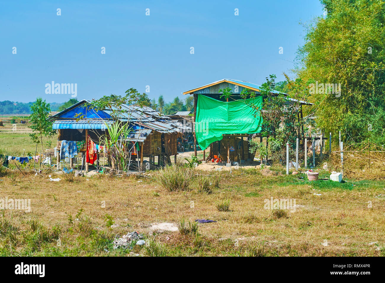 The poor stilt shanties of Burmese peasants, made of different ...