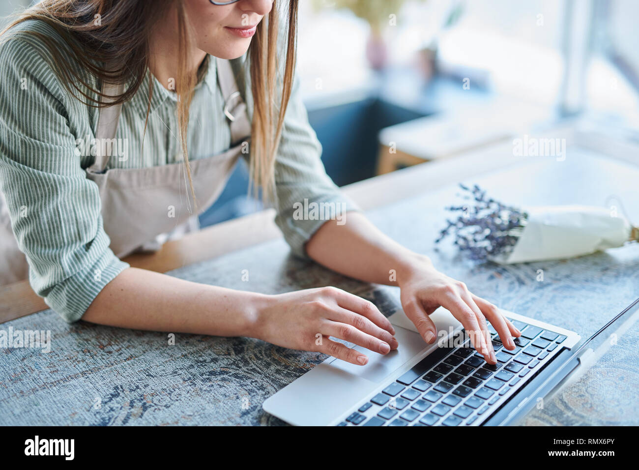 Woman bending over table hi-res stock photography and images - Alamy