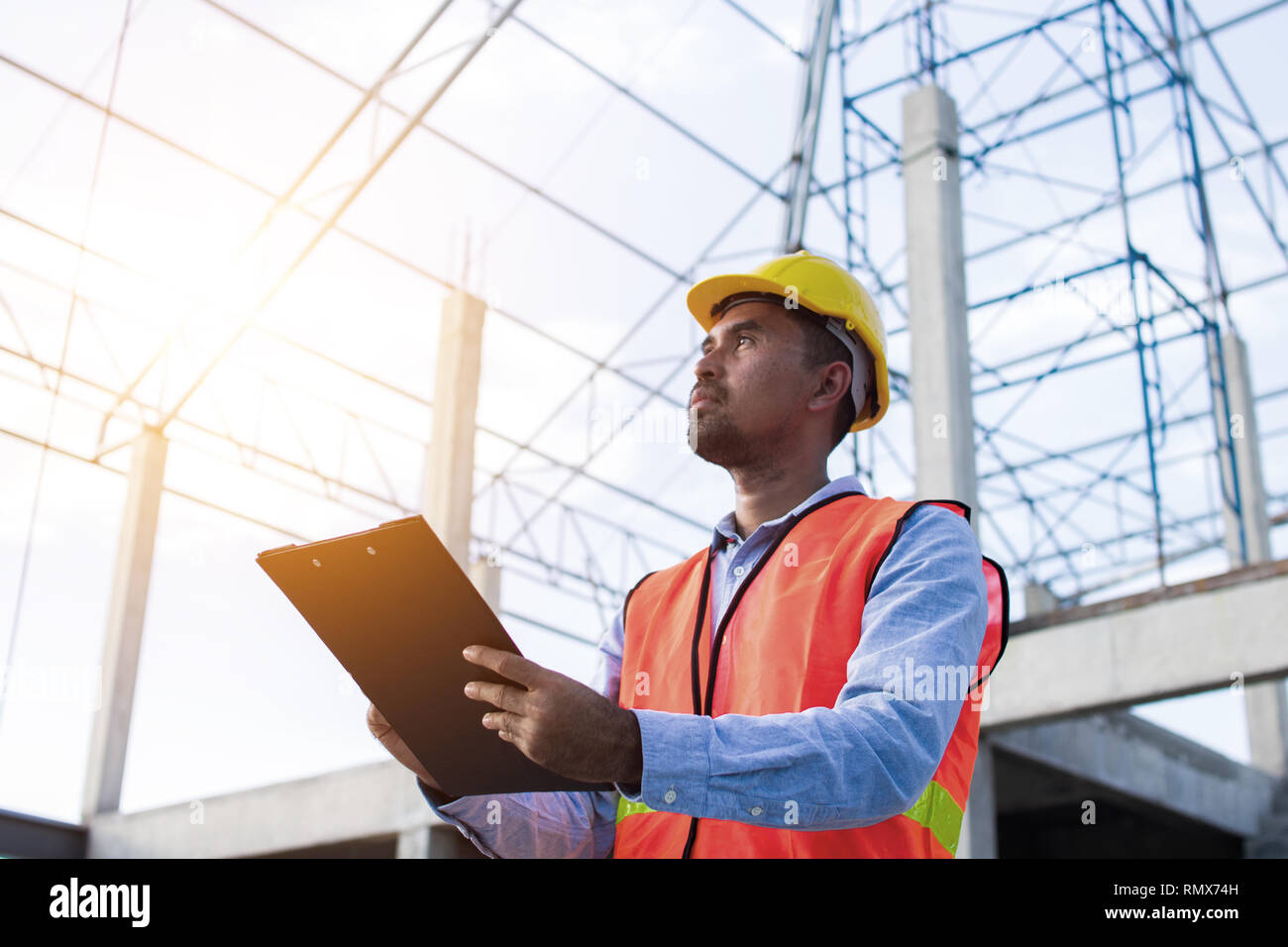 Engineer or inspector checking progressing work in construction site ...