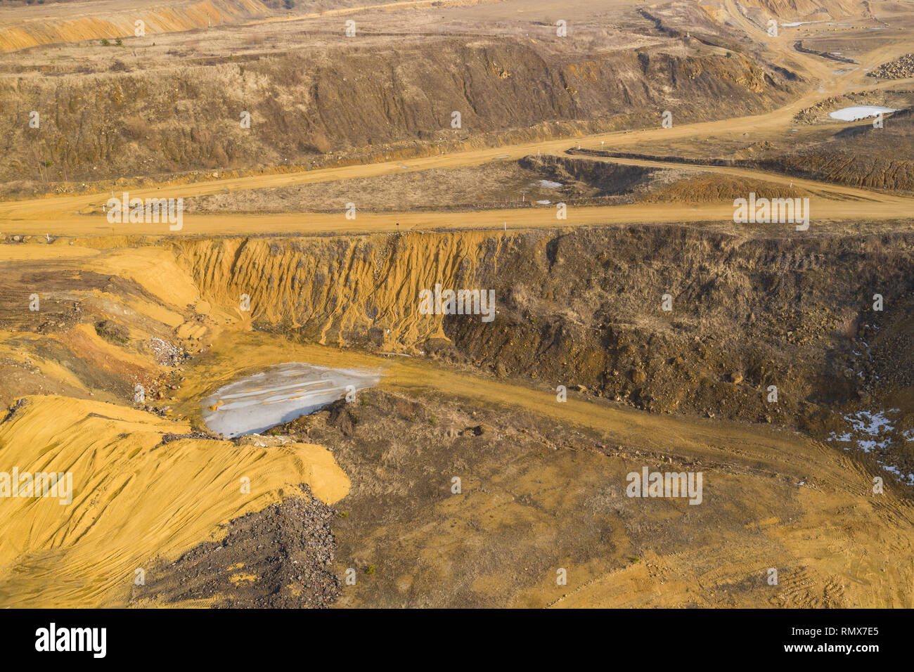 Aerial view of sandpit and factory plant producing sand materials for ...