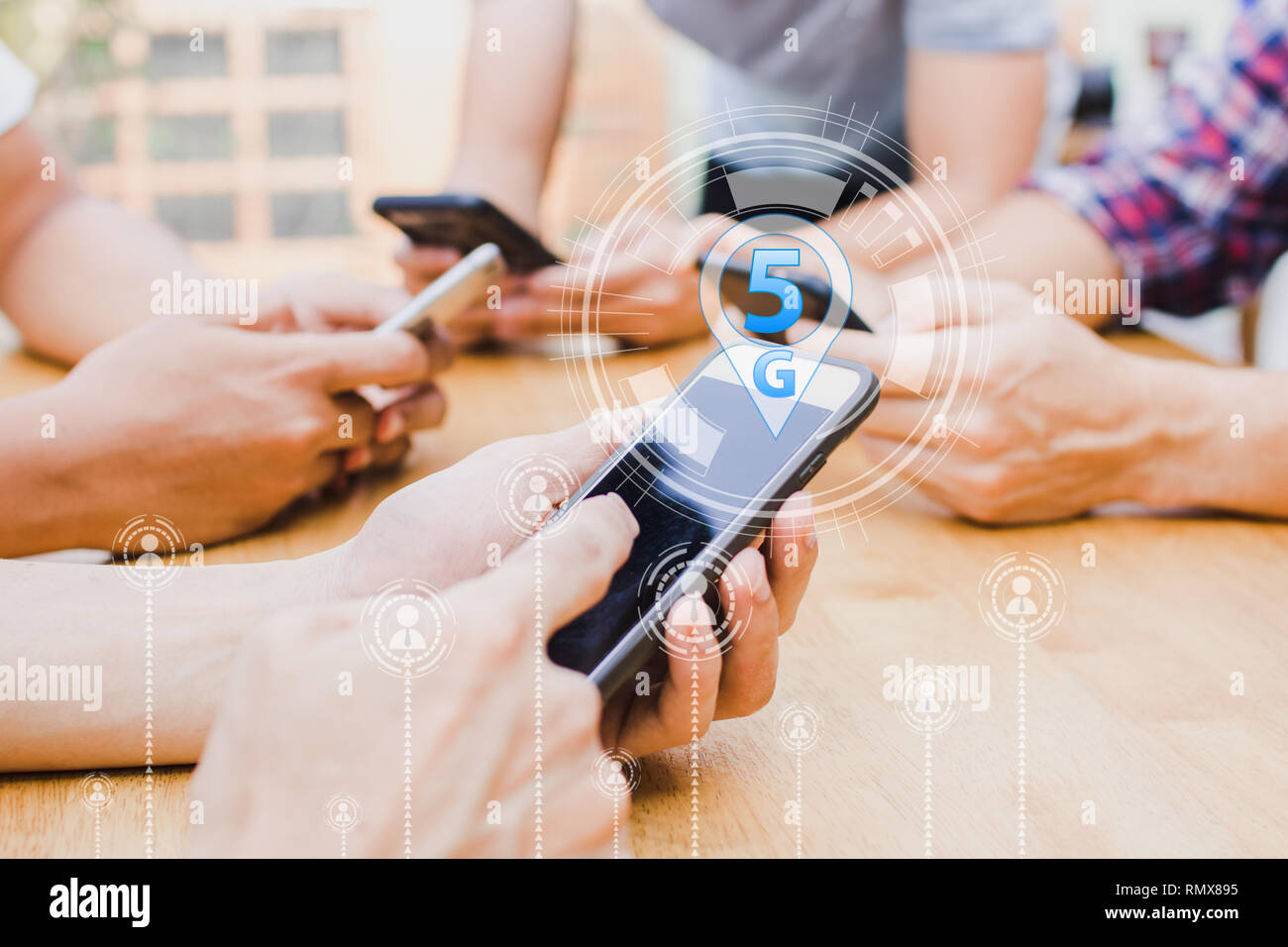 group of people use phone on table with connection icon and 5G concept ...