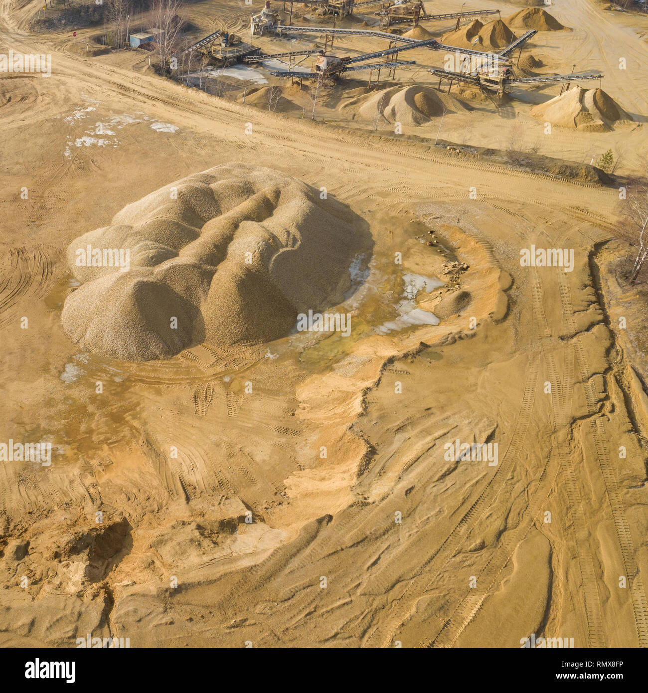 Aerial view of sandpit and factory plant producing sand materials for ...
