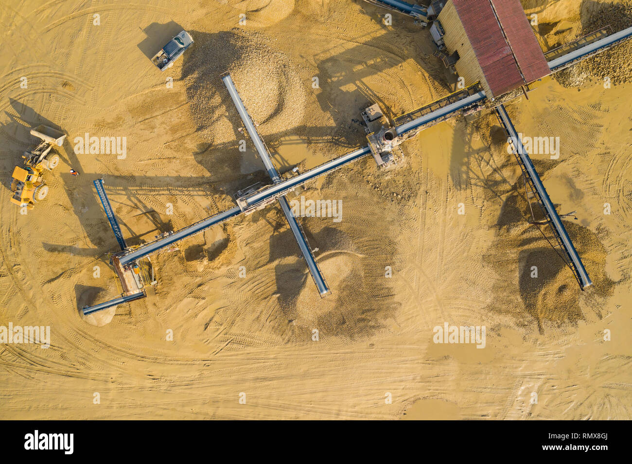 Aerial view of sandpit and factory plant producing sand materials for ...
