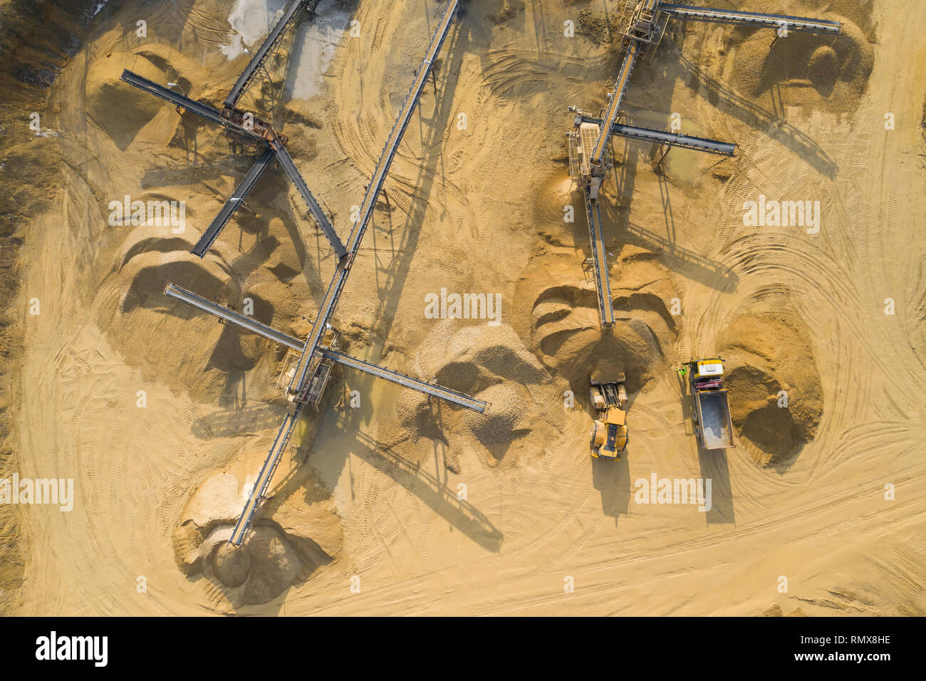 Aerial view of sandpit and factory plant producing sand materials for ...