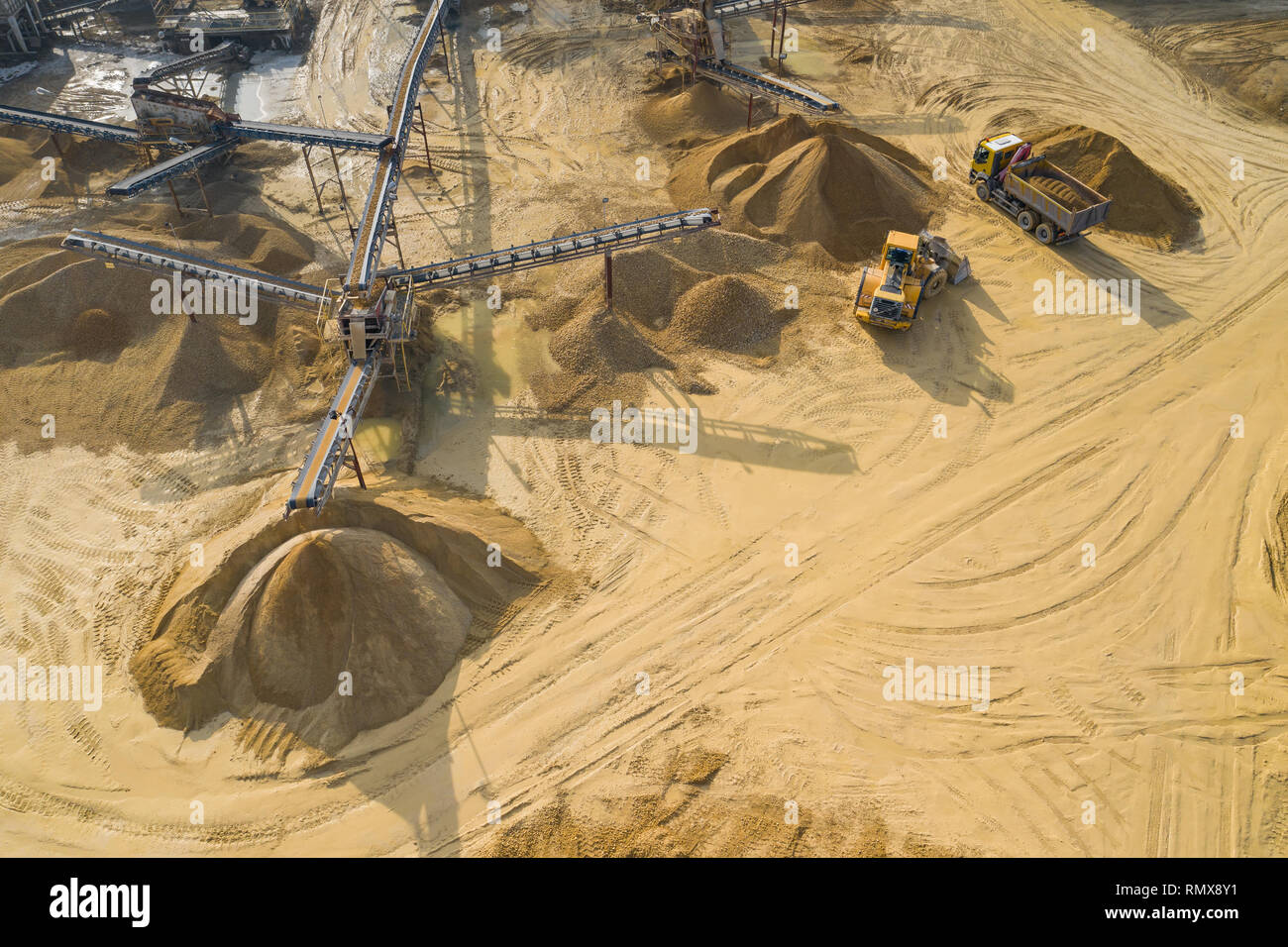Aerial view of sandpit and factory plant producing sand materials for ...